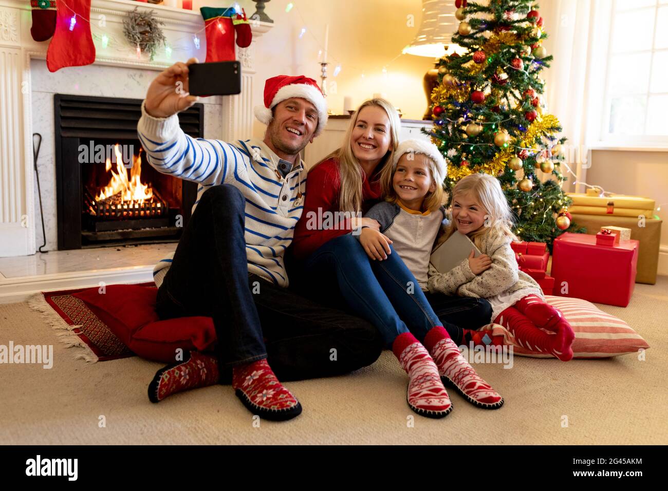 Family at home at Christmas time Stock Photo - Alamy