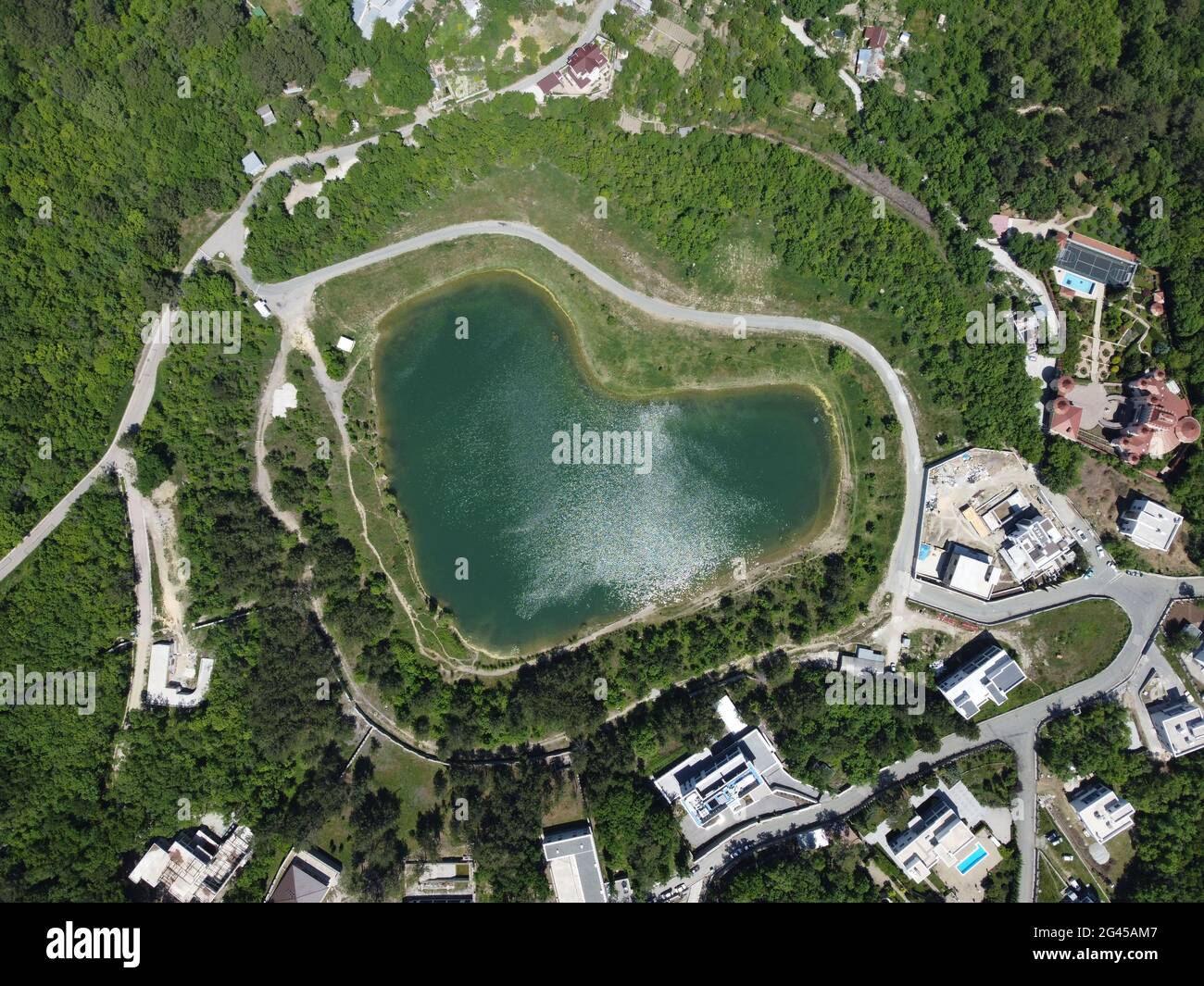 Heart shaped love lake shot. Aerial drone view of peace symbol in ...