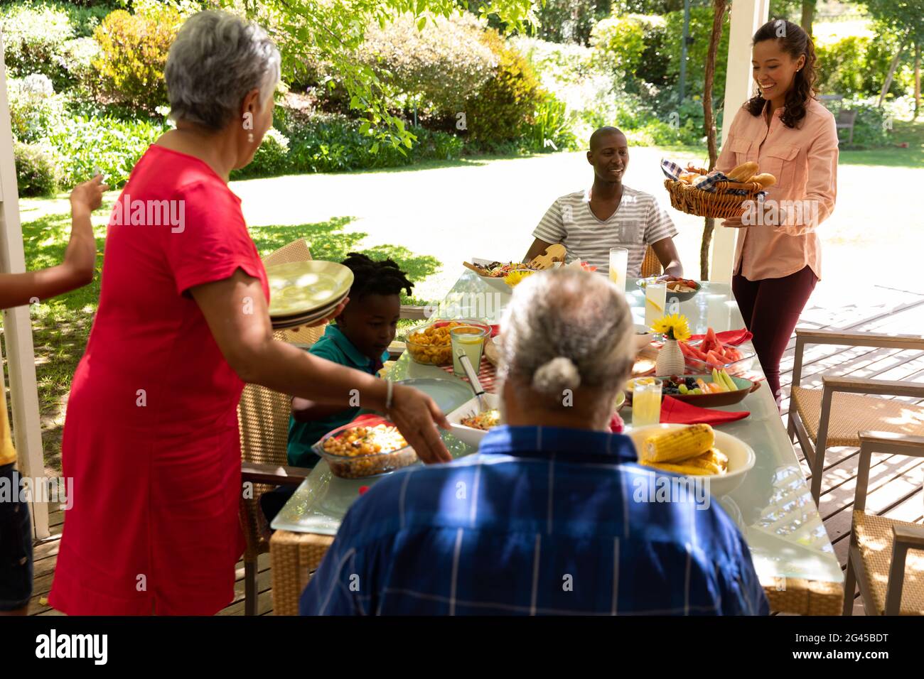 Woman carrying food garden lunch hi-res stock photography and images ...