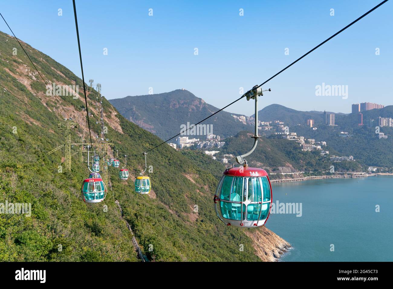 The sunny view of cable car and theme park near to ocean Stock Photo ...