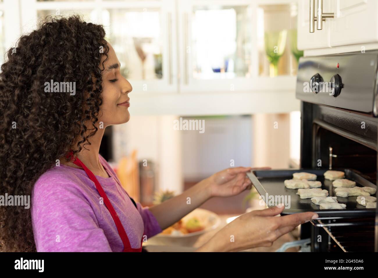 Woman making Christmas cookies at home Stock Photo - Alamy