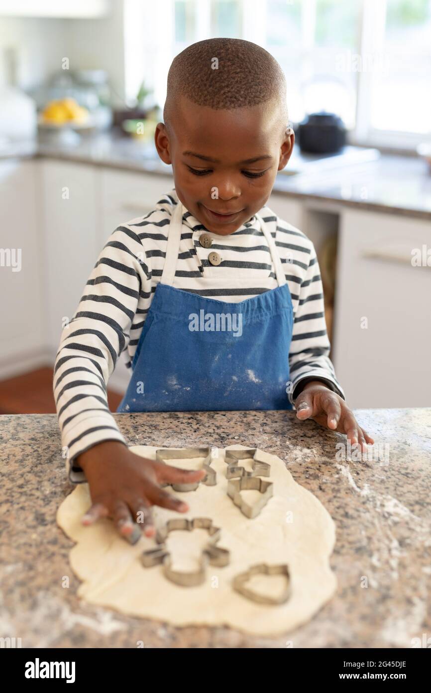 Boy cutting out cookies hi-res stock photography and images - Alamy