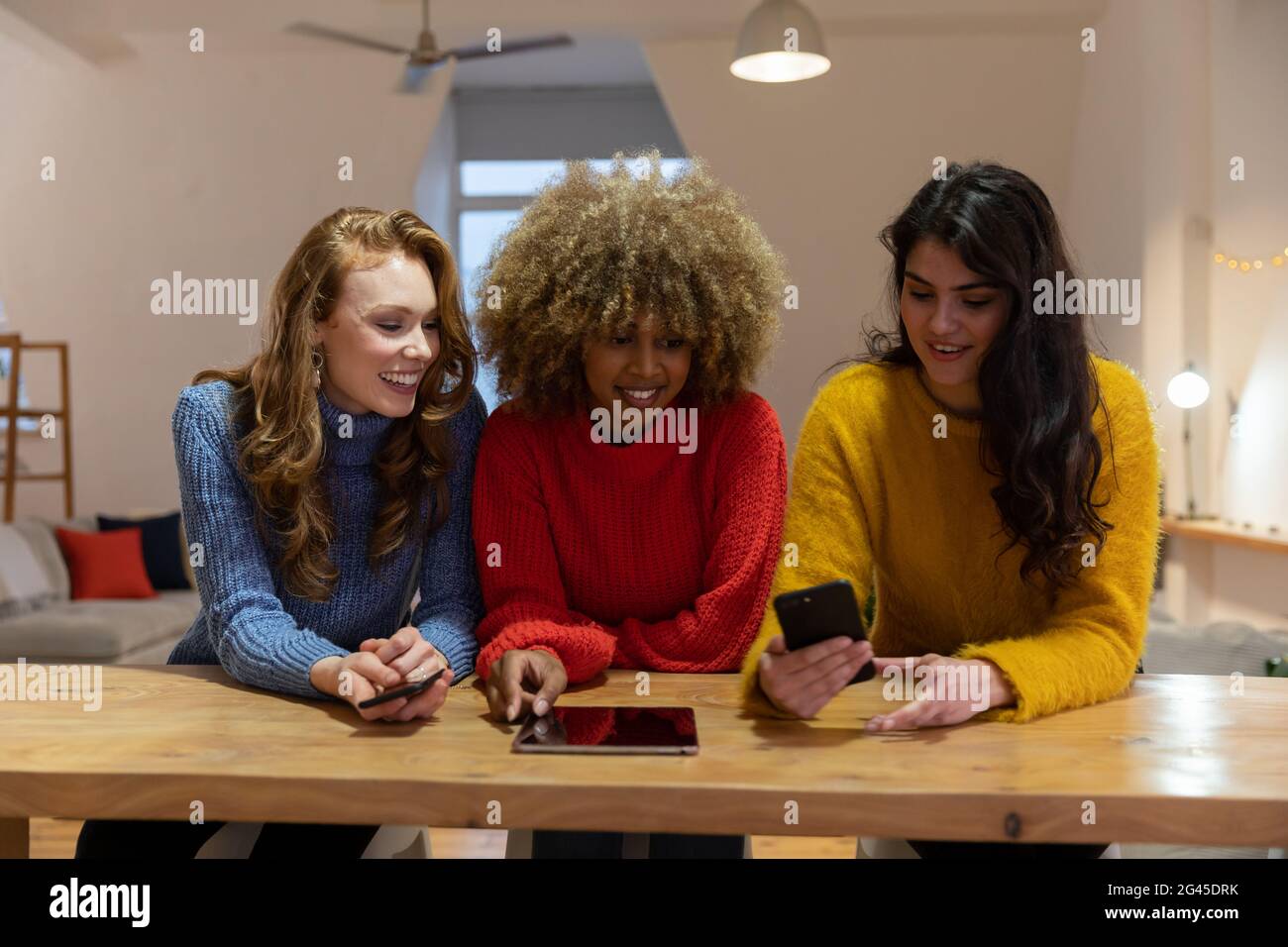 Millennial adult friends socialising together at home Stock Photo - Alamy