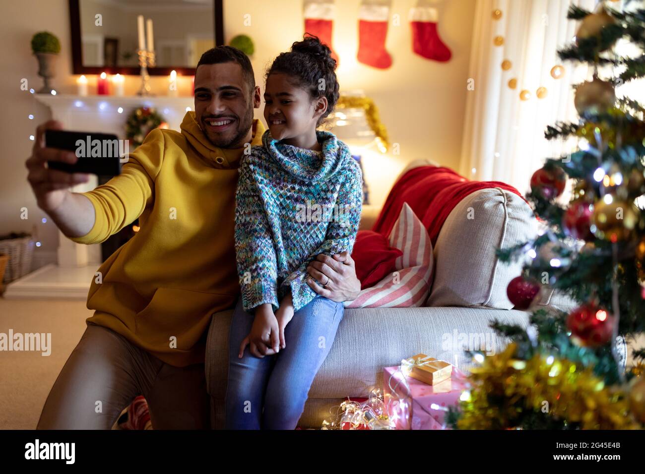 Family at home at Christmas time Stock Photo - Alamy