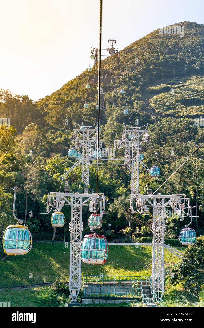 The sunny view of cable car and theme park near to ocean Stock Photo ...