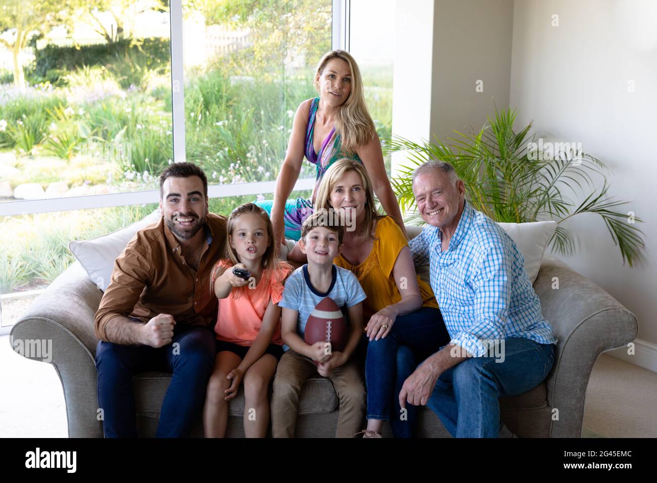 Caucasian family in the living room at home Stock Photo - Alamy