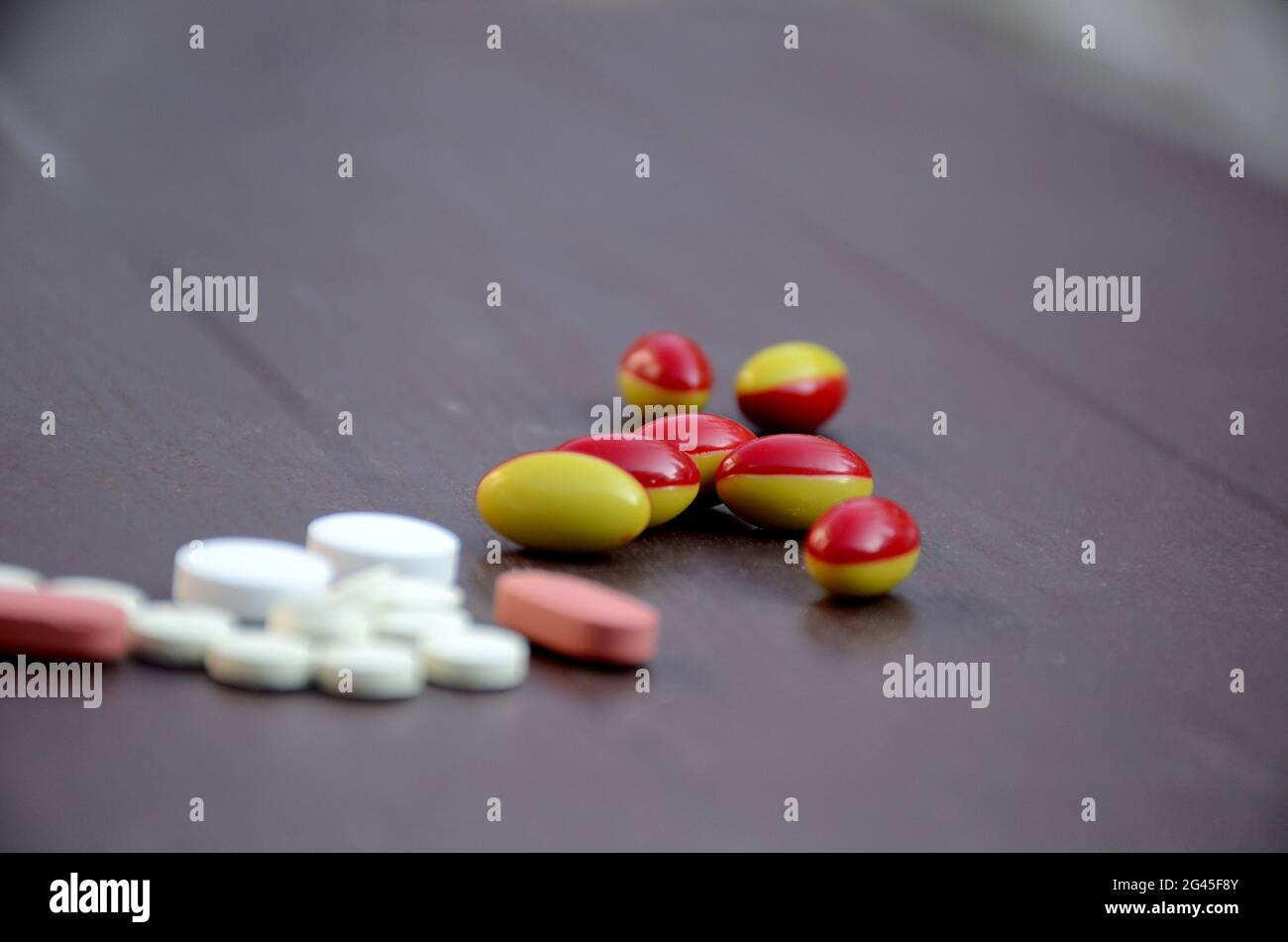 closeup bunch the pink ,white with red,yellow color small medicines ...