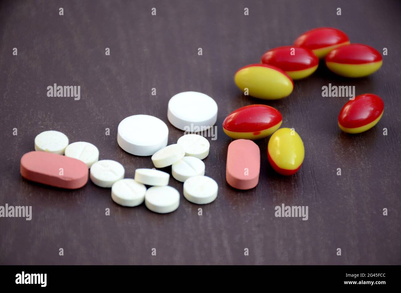 Yellow and red capsule hi-res stock photography and images - Alamy