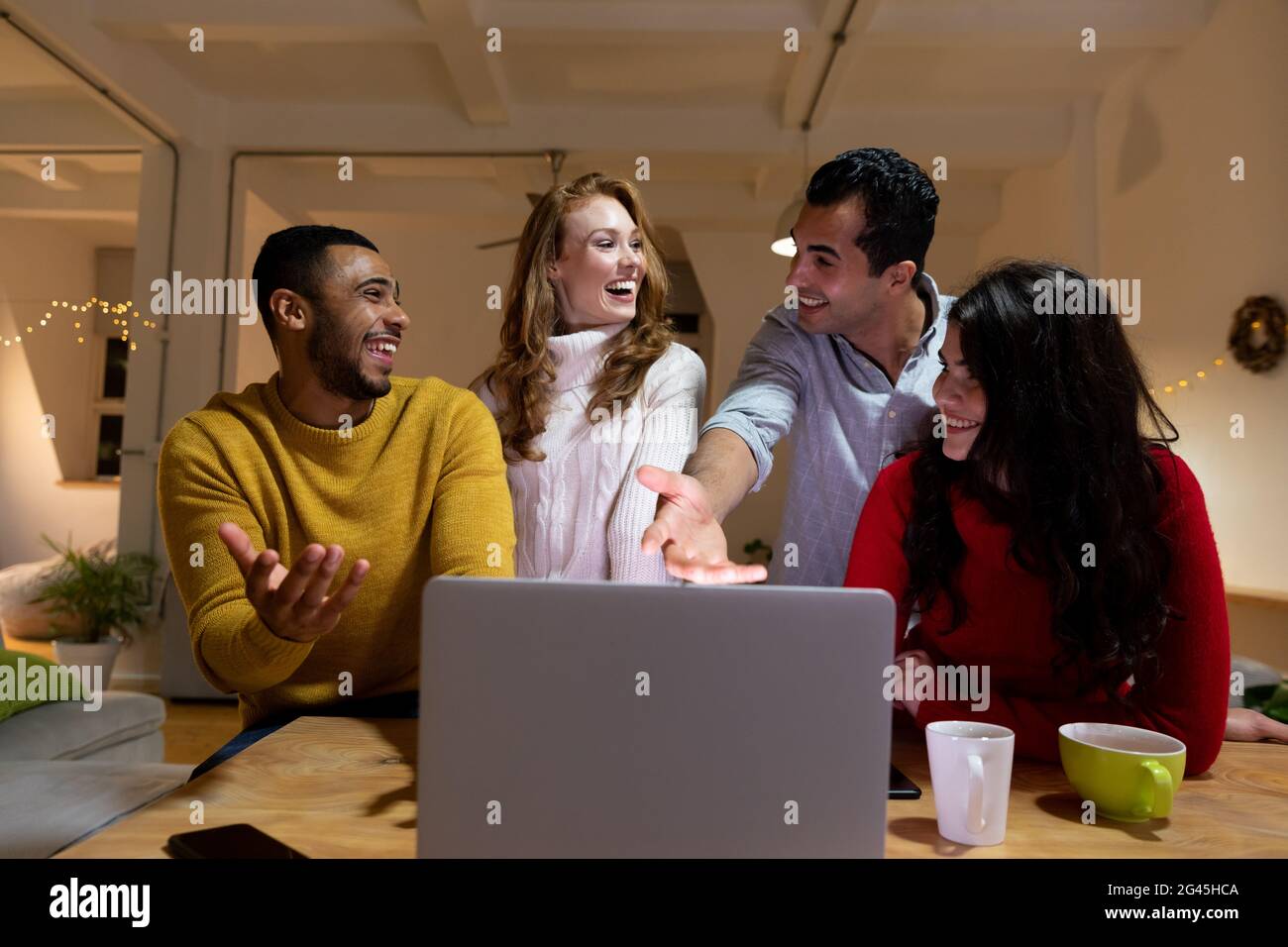 Millennial adult friends socialising together at home Stock Photo - Alamy