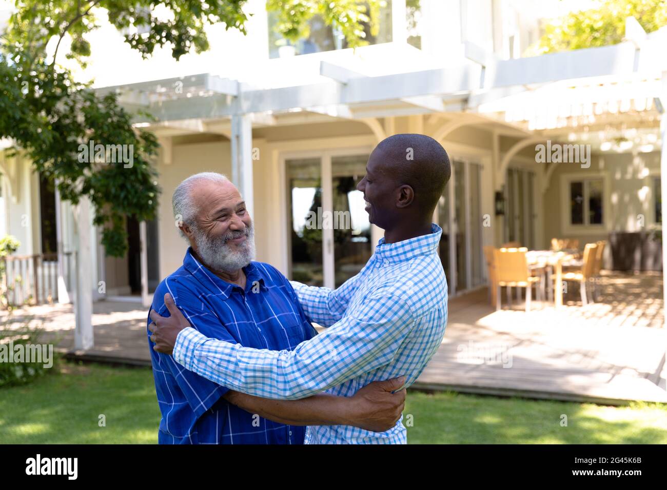 Man and his father standing in the garden Stock Photo - Alamy