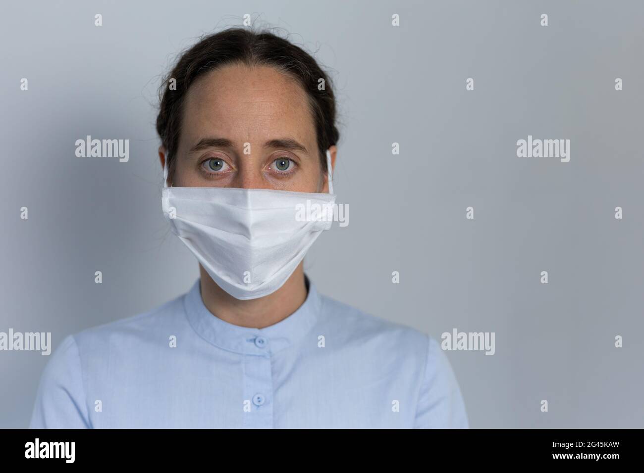 Healthcare worker wearing protective suit and face mask during ...