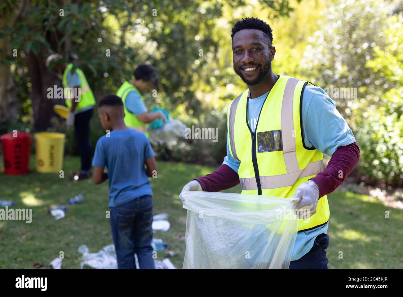 Portrait of an African American man collecting garbage Stock Photo - Alamy