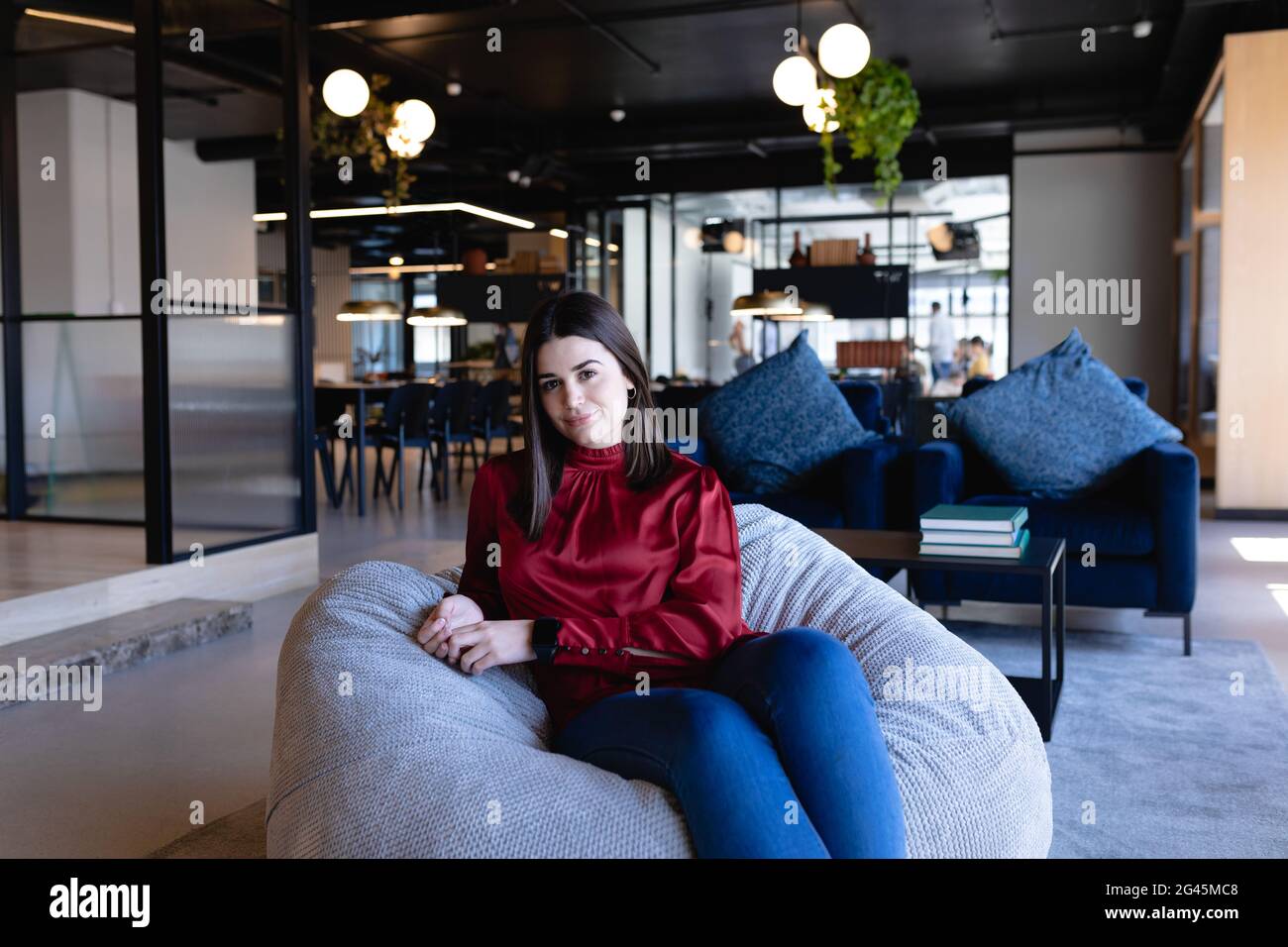 Caucasian woman on a bean bag Stock Photo - Alamy