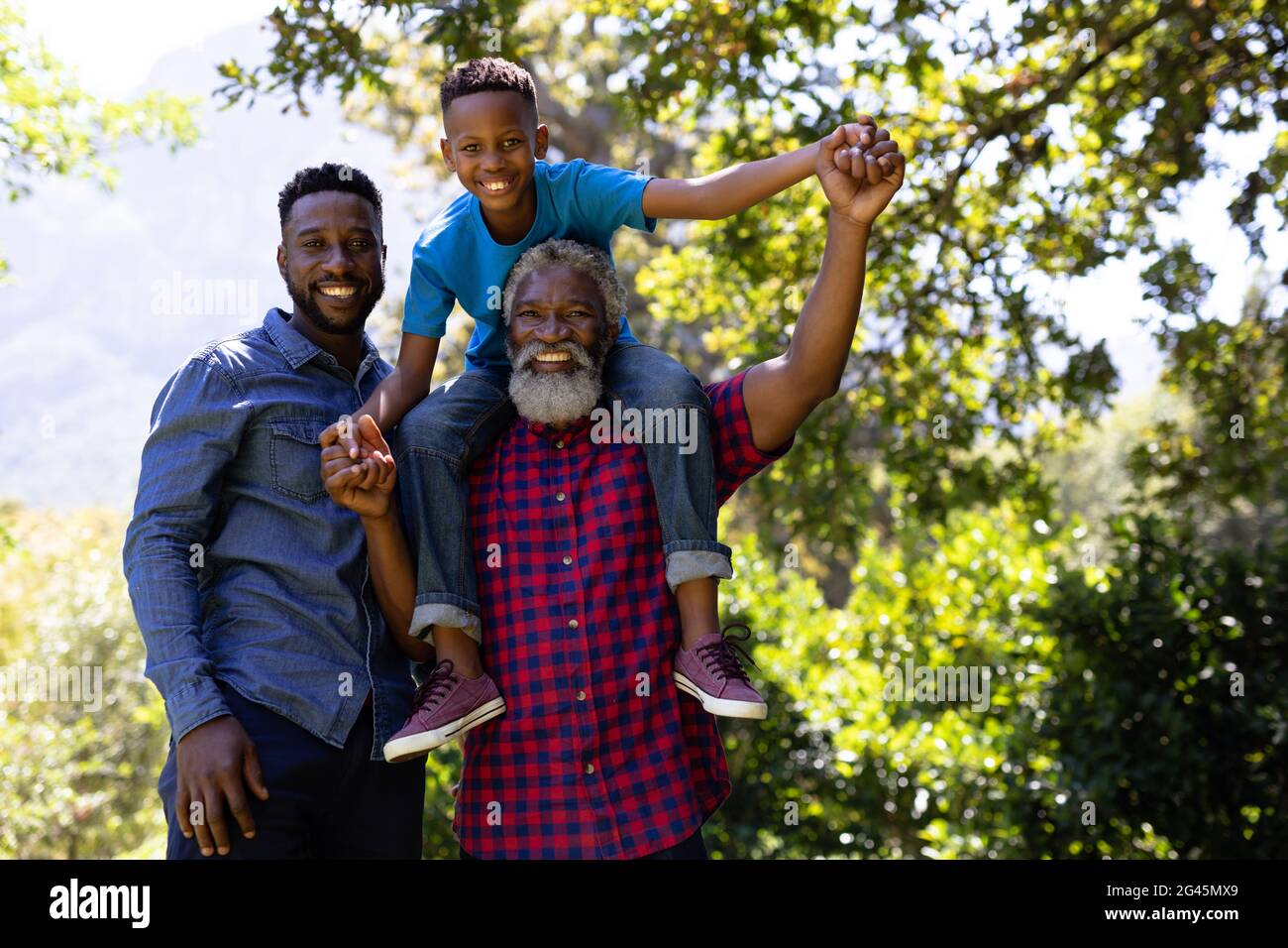 Multi-generation mixed race family enjoying their time at a garden ...