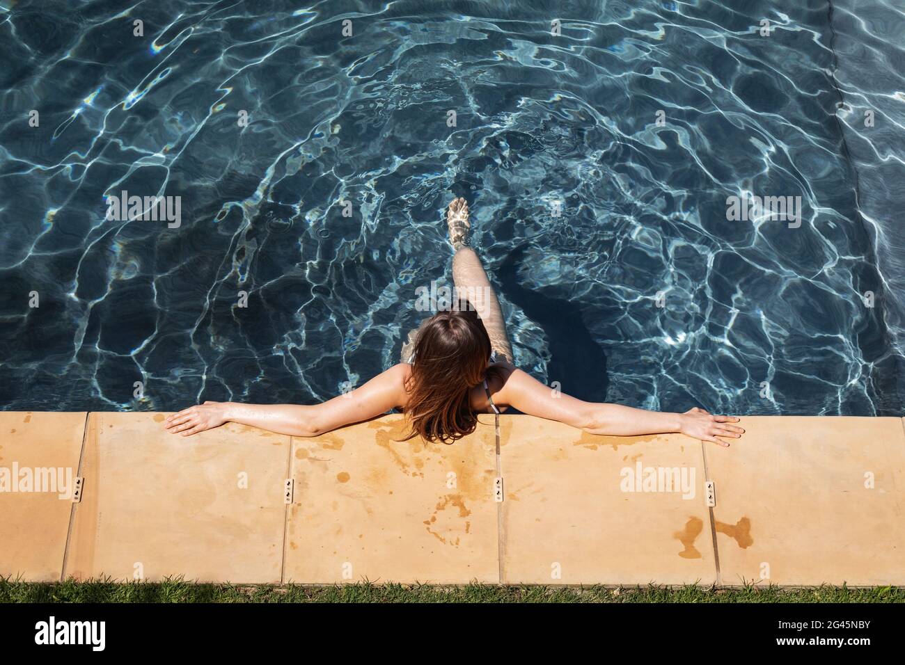 Woman standing in the pool Stock Photo - Alamy