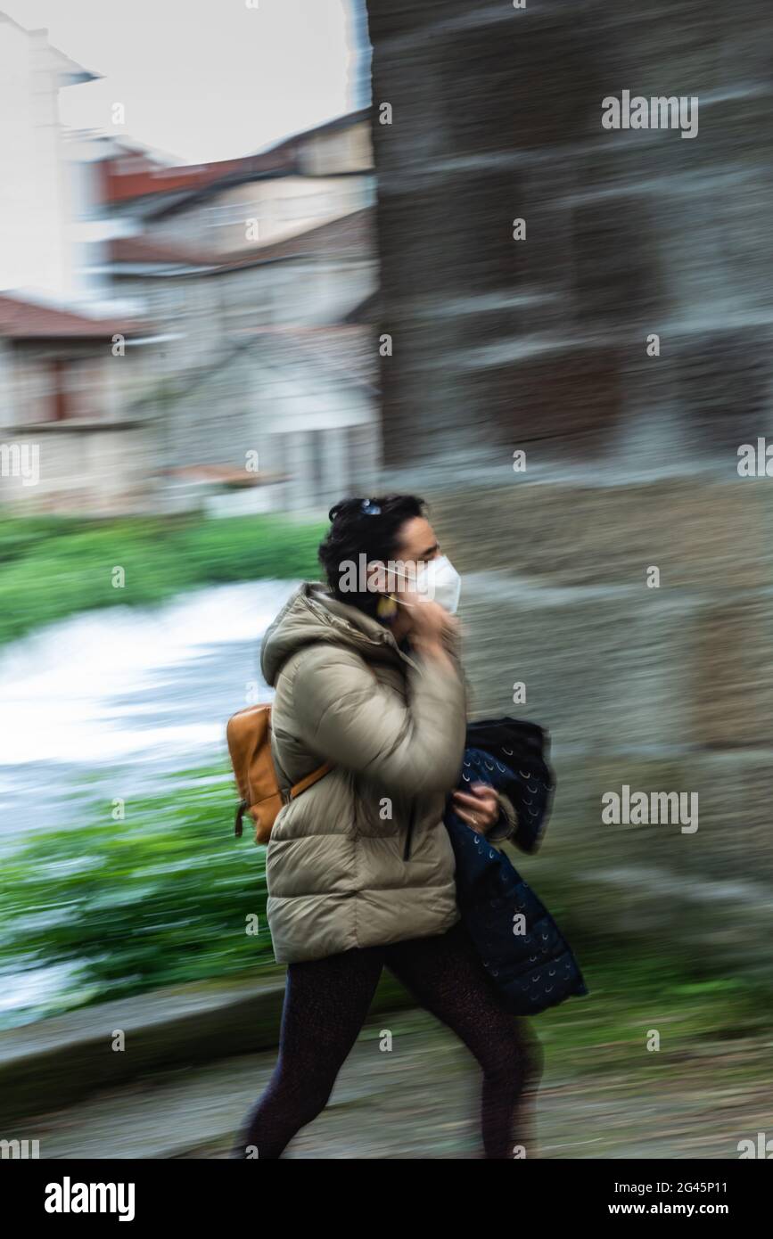 woman walk background with movement effect Stock Photo - Alamy