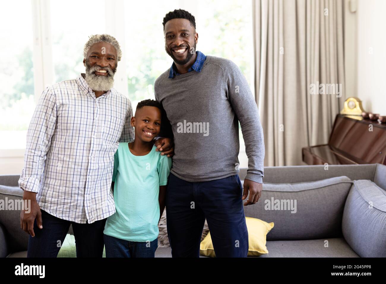 Multi-generation mixed-race family enjoying their time at home Stock ...
