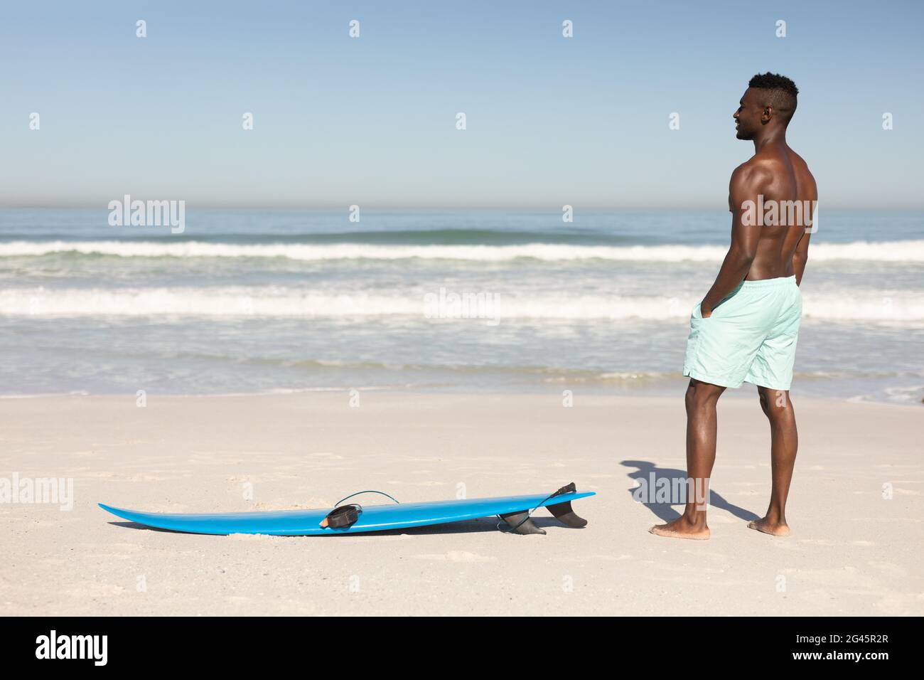 African American man and surf board on the beach Stock Photo - Alamy