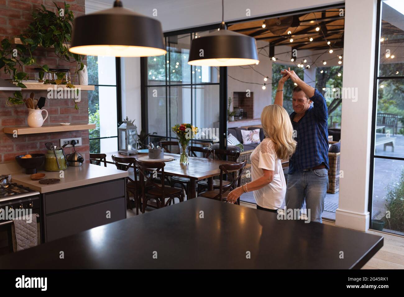 Senior Caucasian couple dancing at home during coronavirus covid19 ...