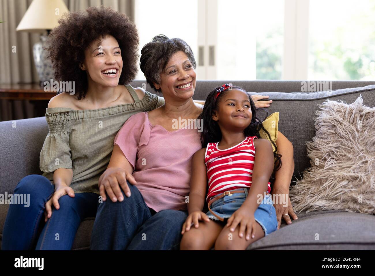 Multi-generation mixed-race family enjoying their time at home Stock ...