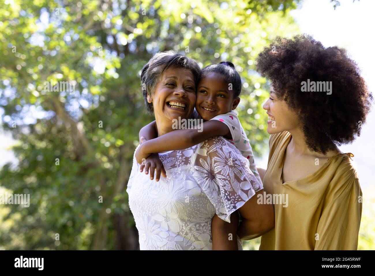 Multi-generation mixed race family enjoying their time at a garden ...