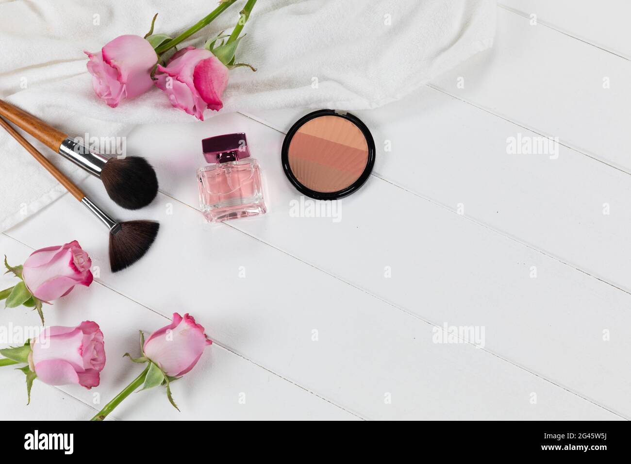 Make up view with pink flowers and perfume on white background Stock ...