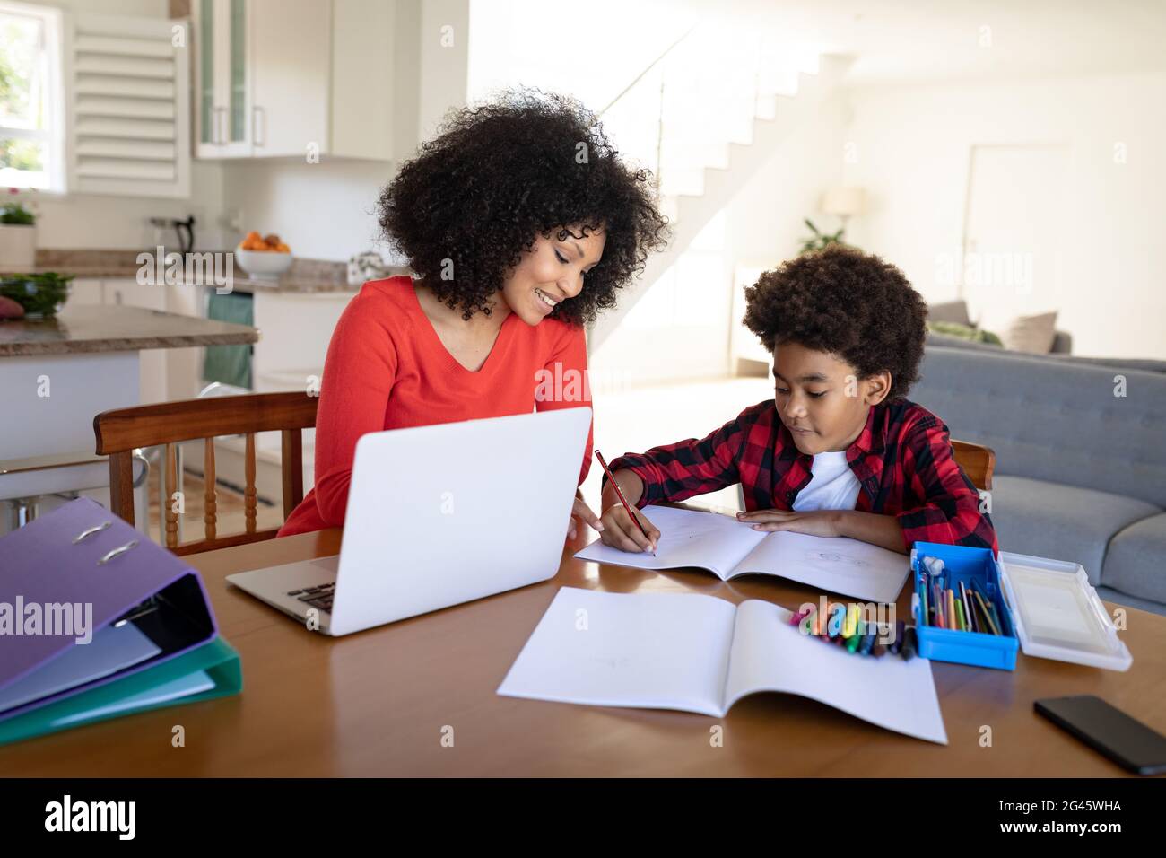 Adult son helping mother laptop hi-res stock photography and images - Alamy