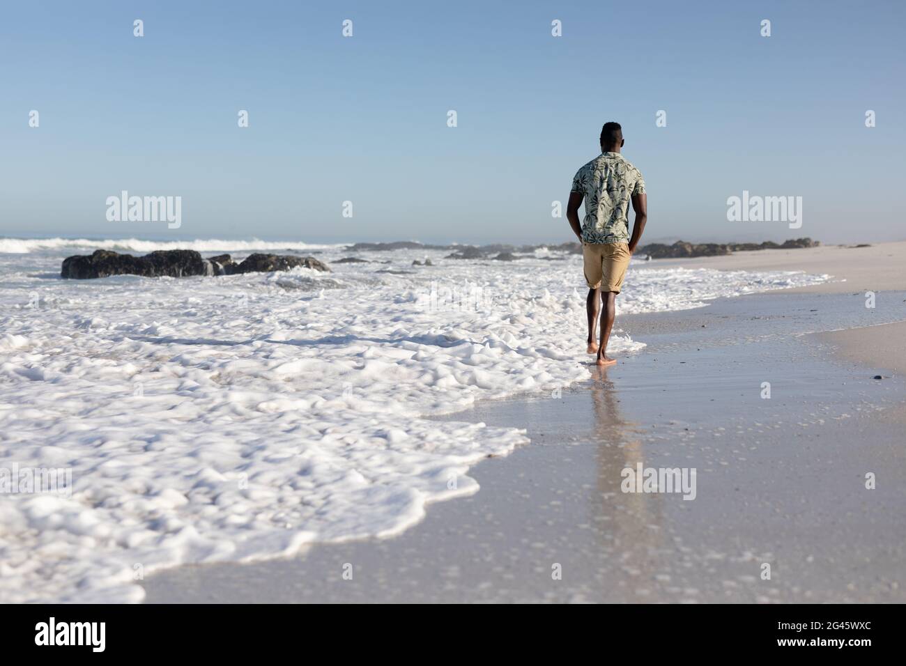 African american man enjoying his time on the beach Stock Photo - Alamy