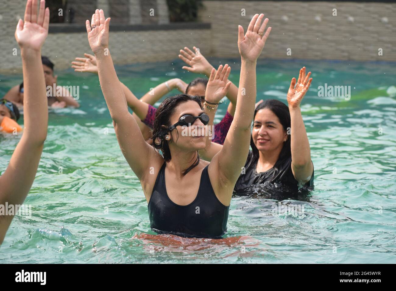 people doing aqua yoga in swimming pool, will be participate also on ...