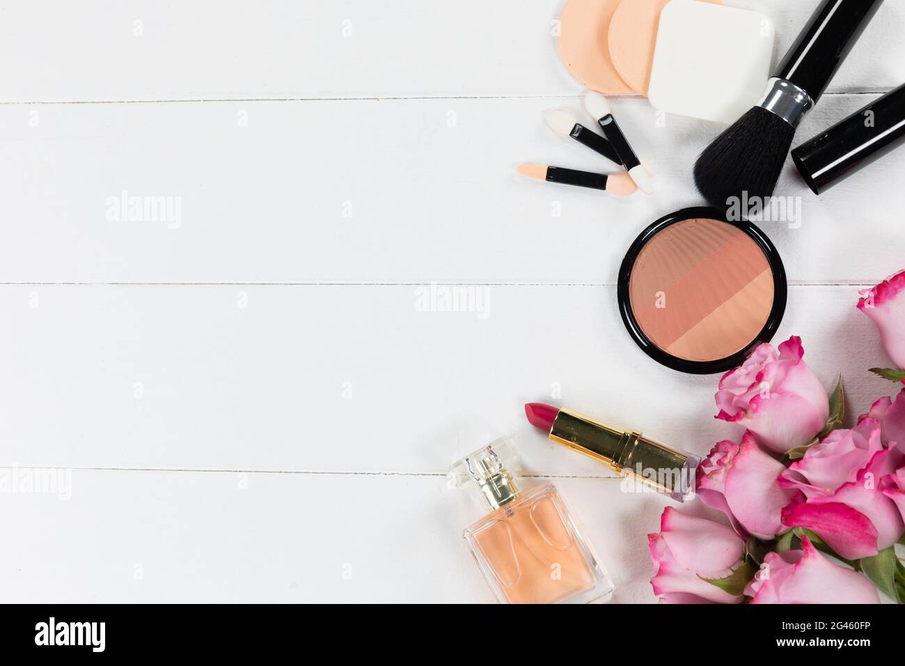 Make up view with pink flowers and perfume on white background Stock ...