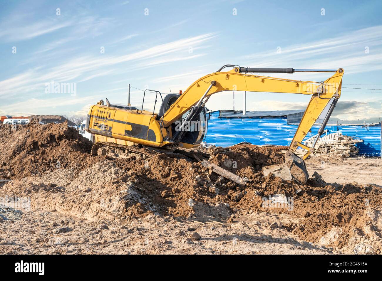excavator bulldozer digging dirt ground, shoveling ion the construction ...