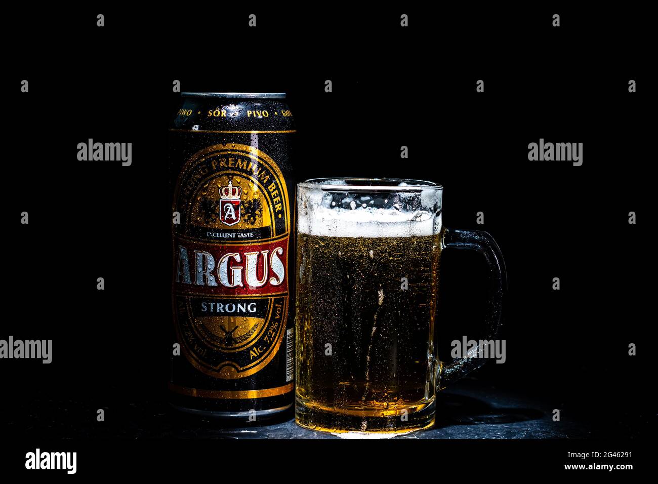 Can of Argus beer and beer glass on dark background. Illustrative ...