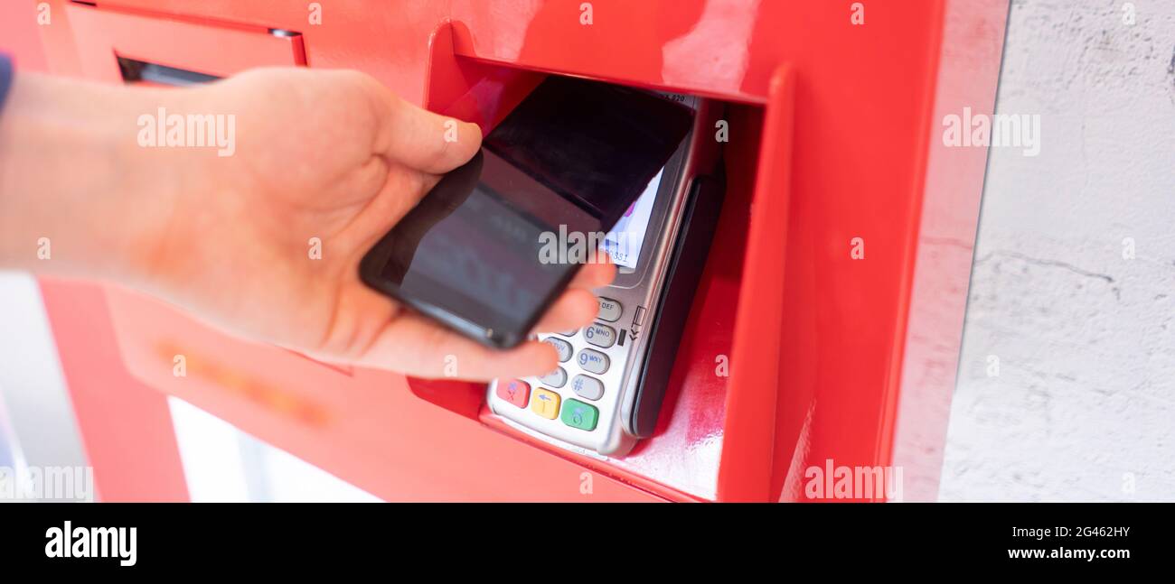 cashless payment with phone to POS terminal with NFC technology Stock ...