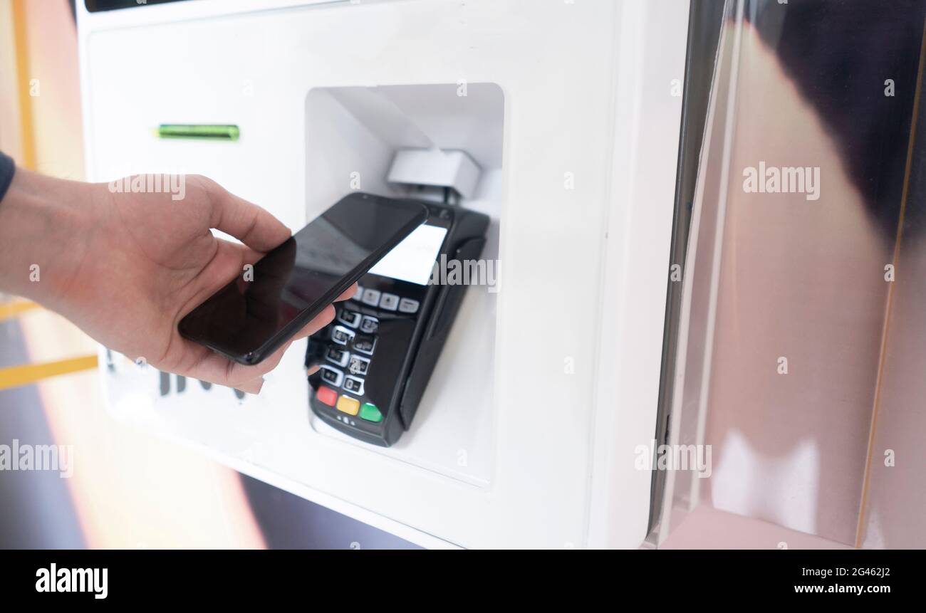 cashless payment with phone to POS terminal with NFC technology Stock ...