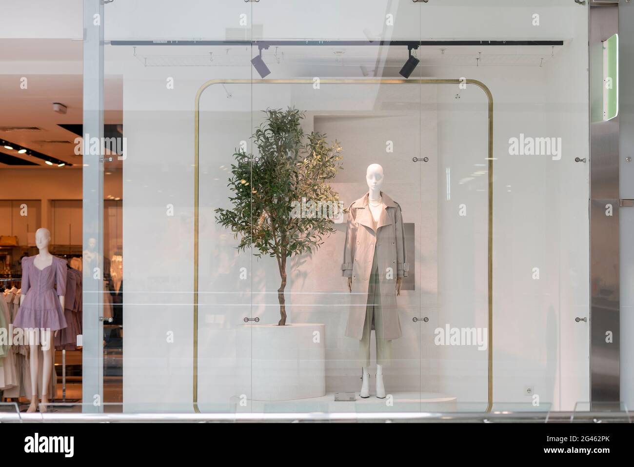 window glass case in the shop with manequins showing new clothes Stock ...