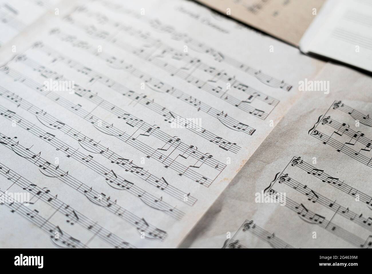 close up ancient old paper sheet with music notes, classic culture arts ...