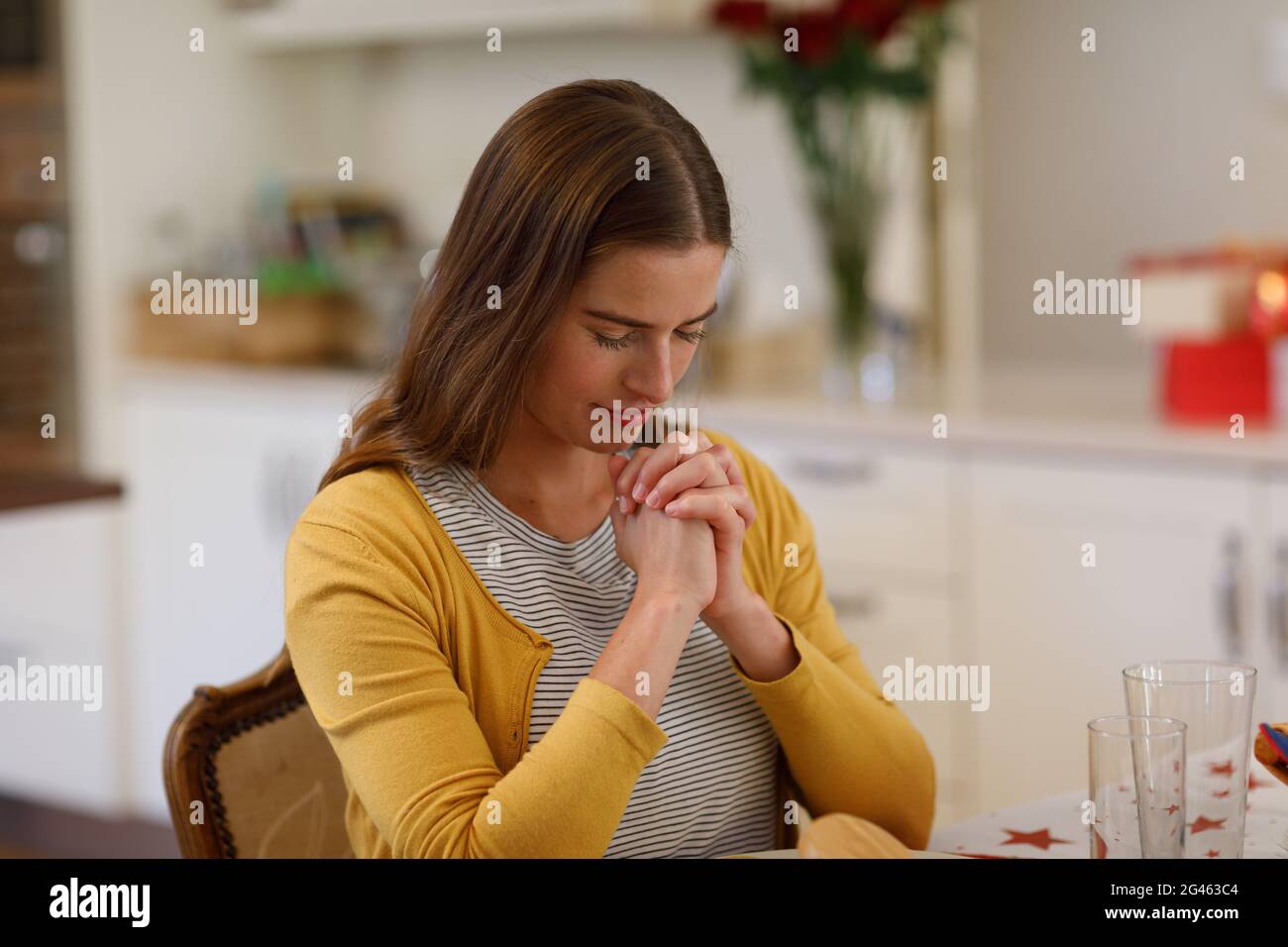 Woman mother praying table hi-res stock photography and images - Alamy