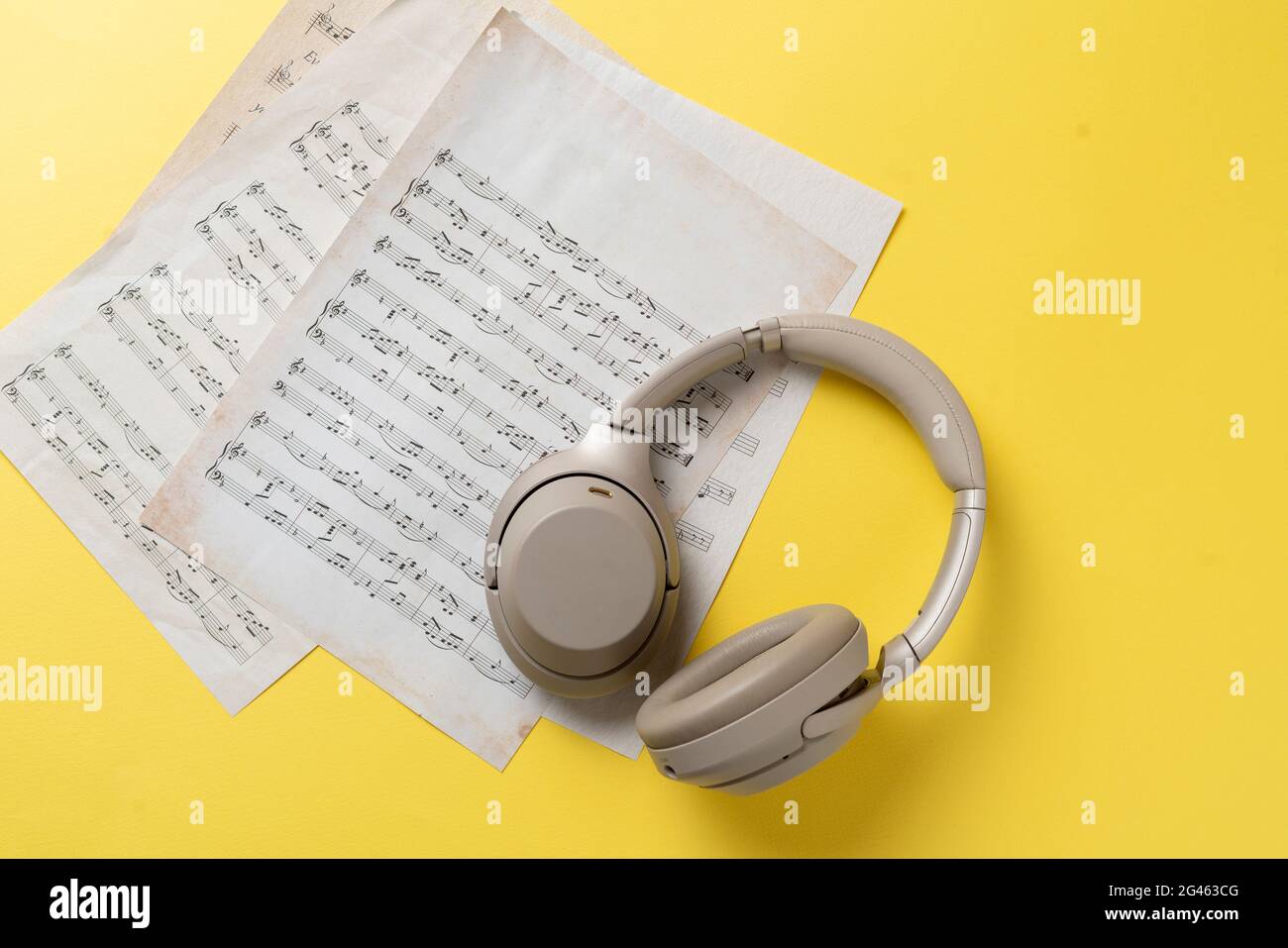 grey headphones on the music notes paper sheet Stock Photo - Alamy