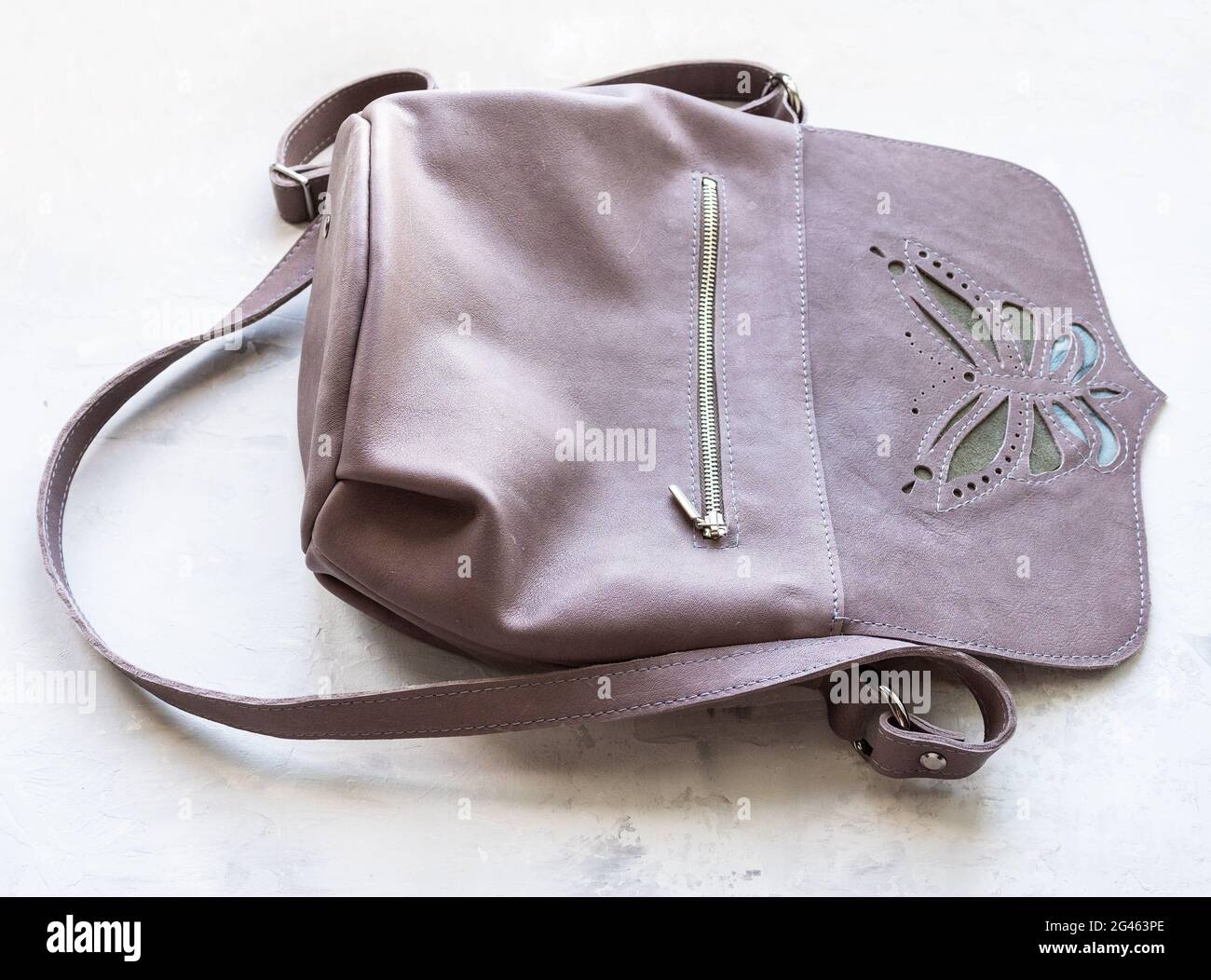 open empty handcrafted leather cross body bag with butterfly applique ...