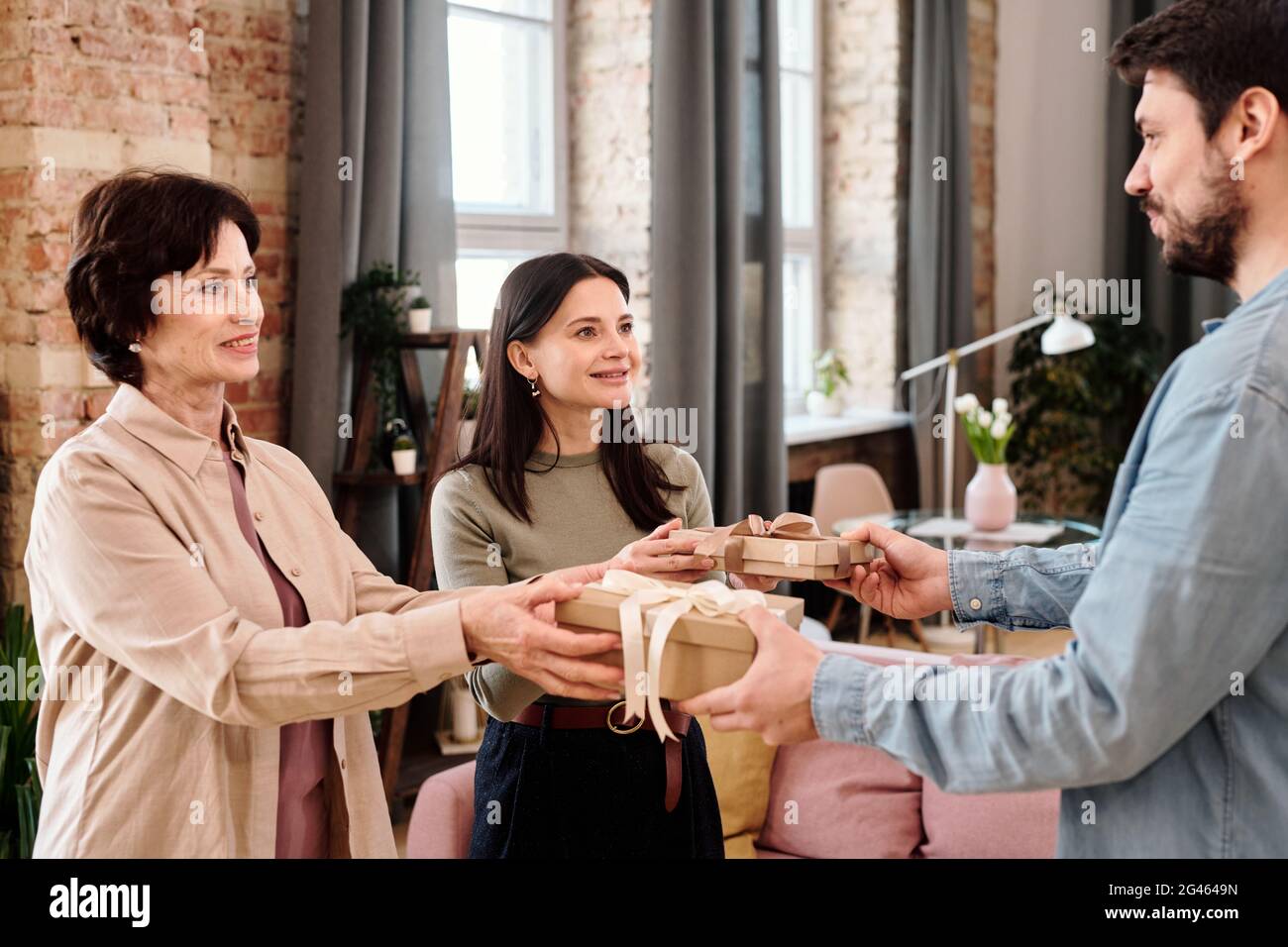 Man giving small presents in hi-res stock photography and images - Alamy