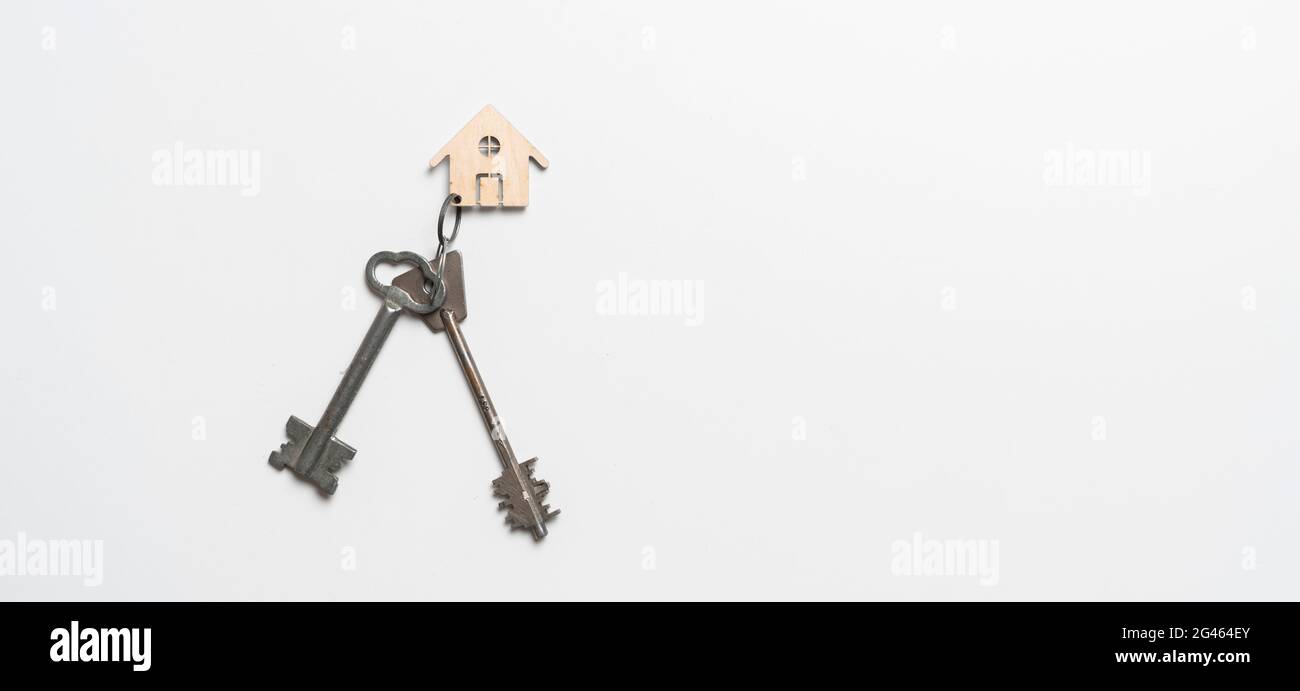flat lay of home keys on the table, symbol of real estate investment ...