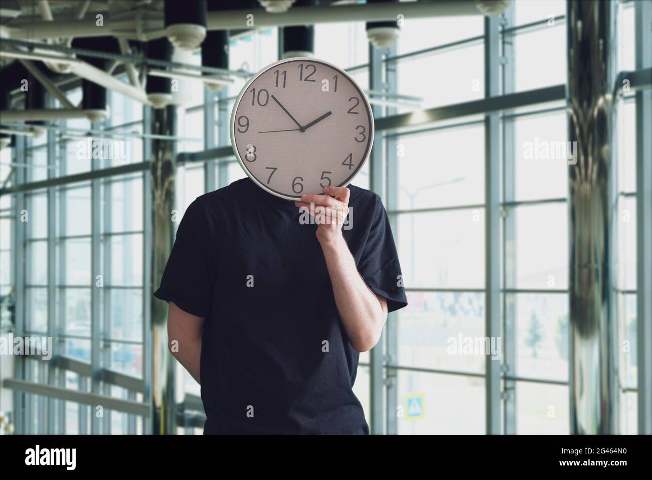 time management concept, employee person holding a clock Stock Photo ...
