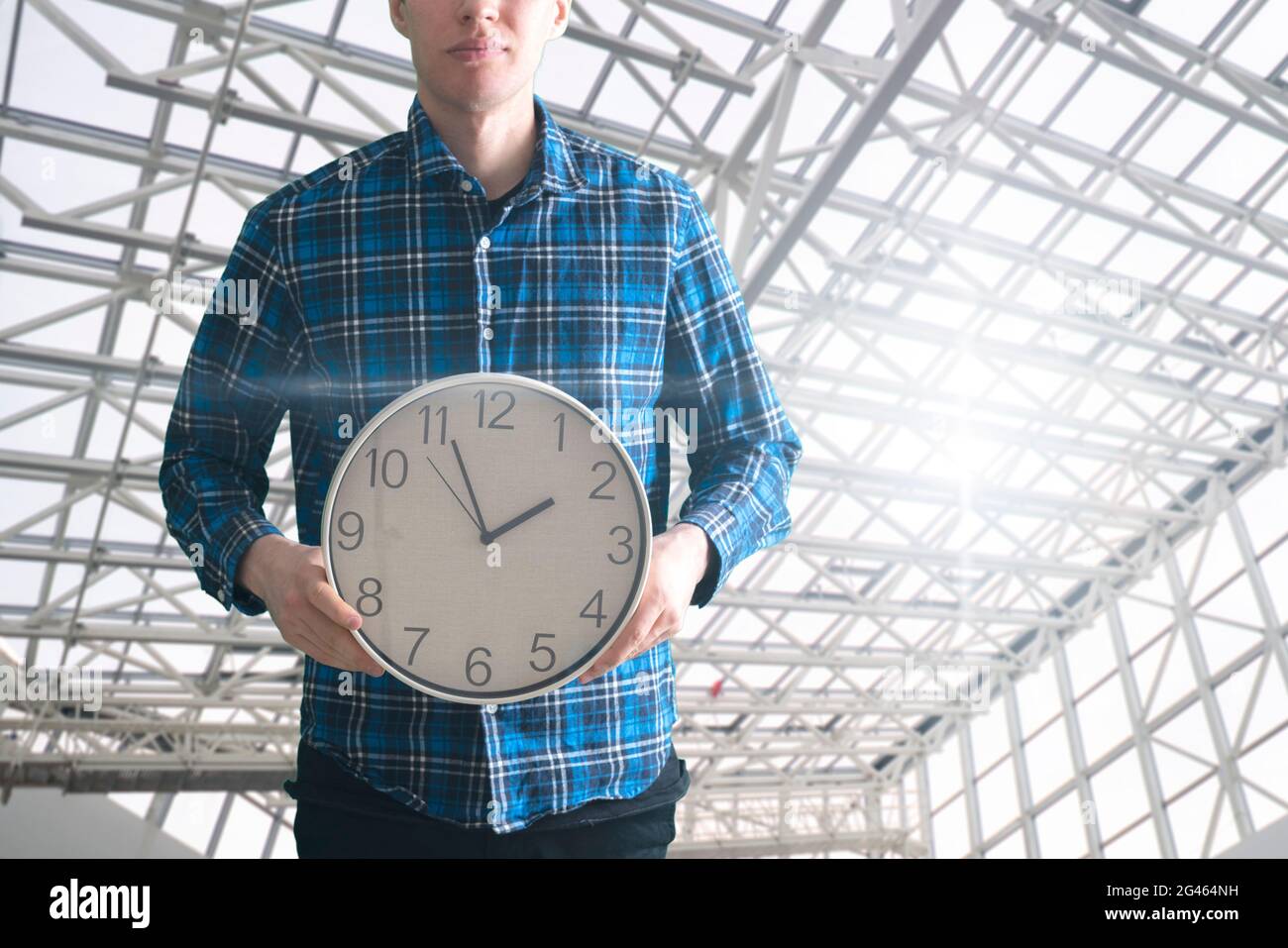 time management concept, employee person holding a clock Stock Photo ...