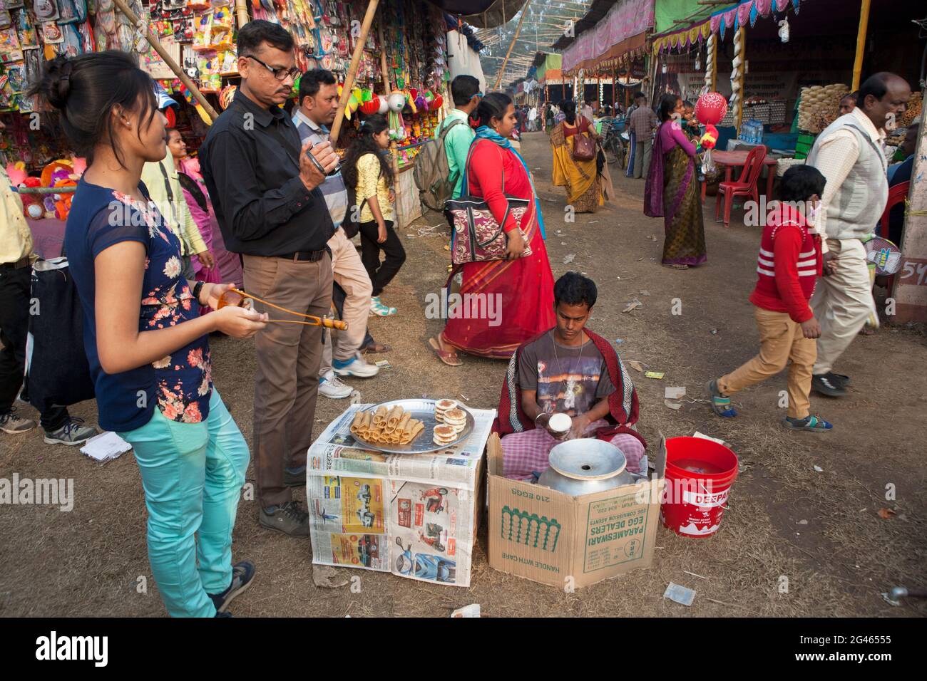 people selling traditional boiled rice food in Poush Mela, a rural ...