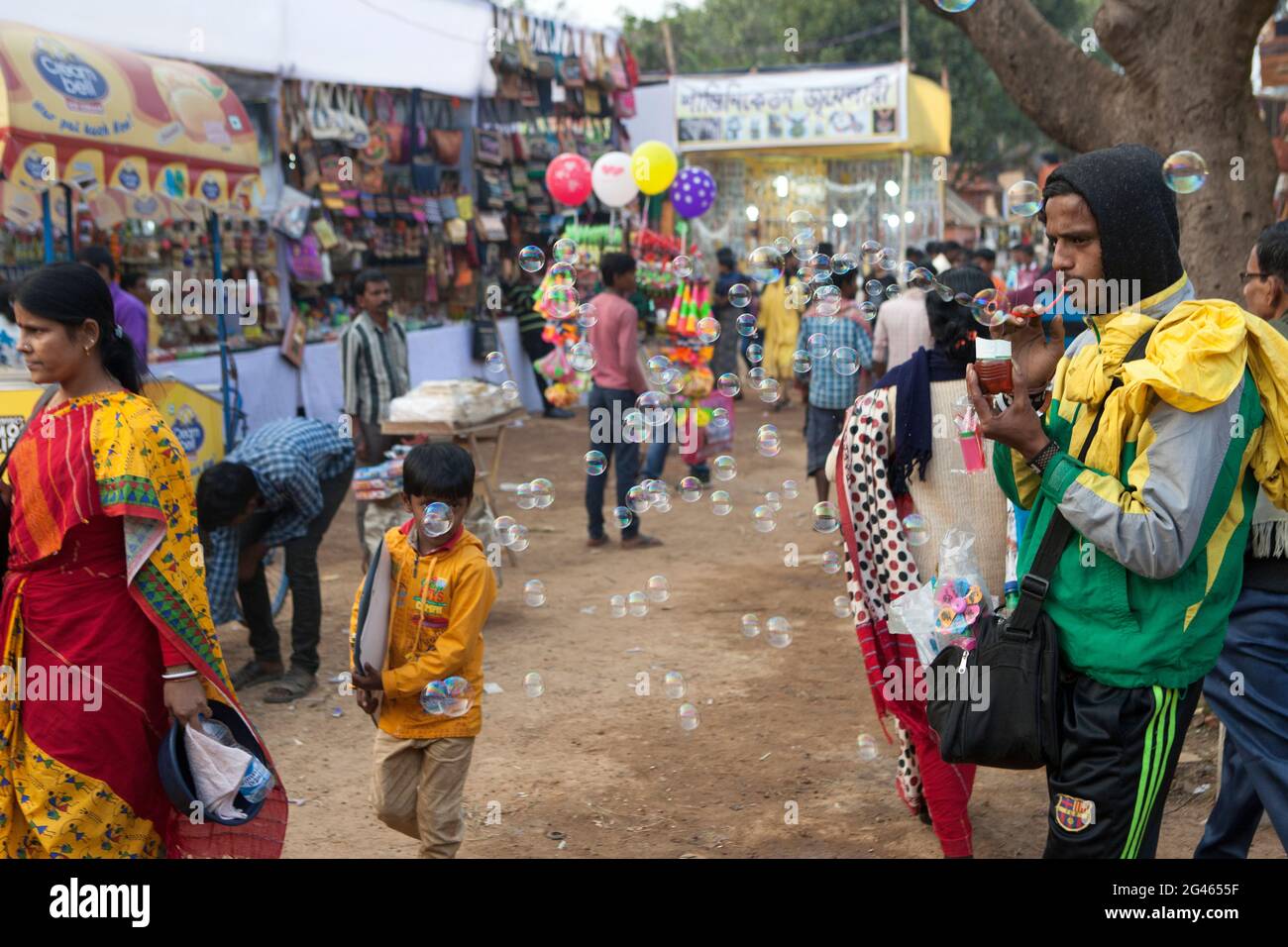 a local man selling traditional toy in Poush Mela, a rural historical ...