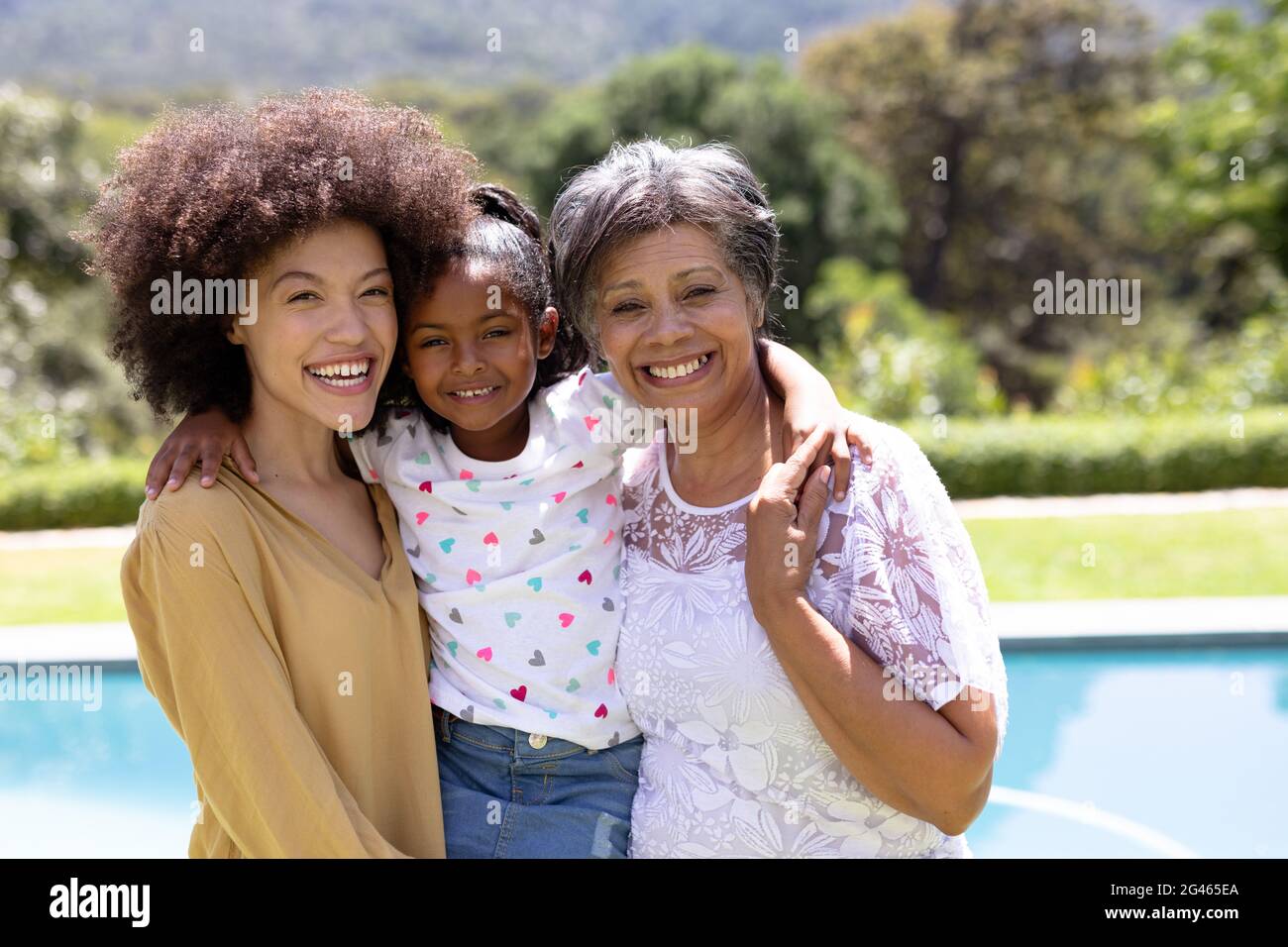 Multi-generation mixed race family enjoying their time at a garden ...