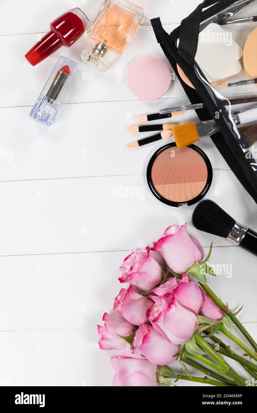 Make up view with pink flowers and perfume on white background Stock ...