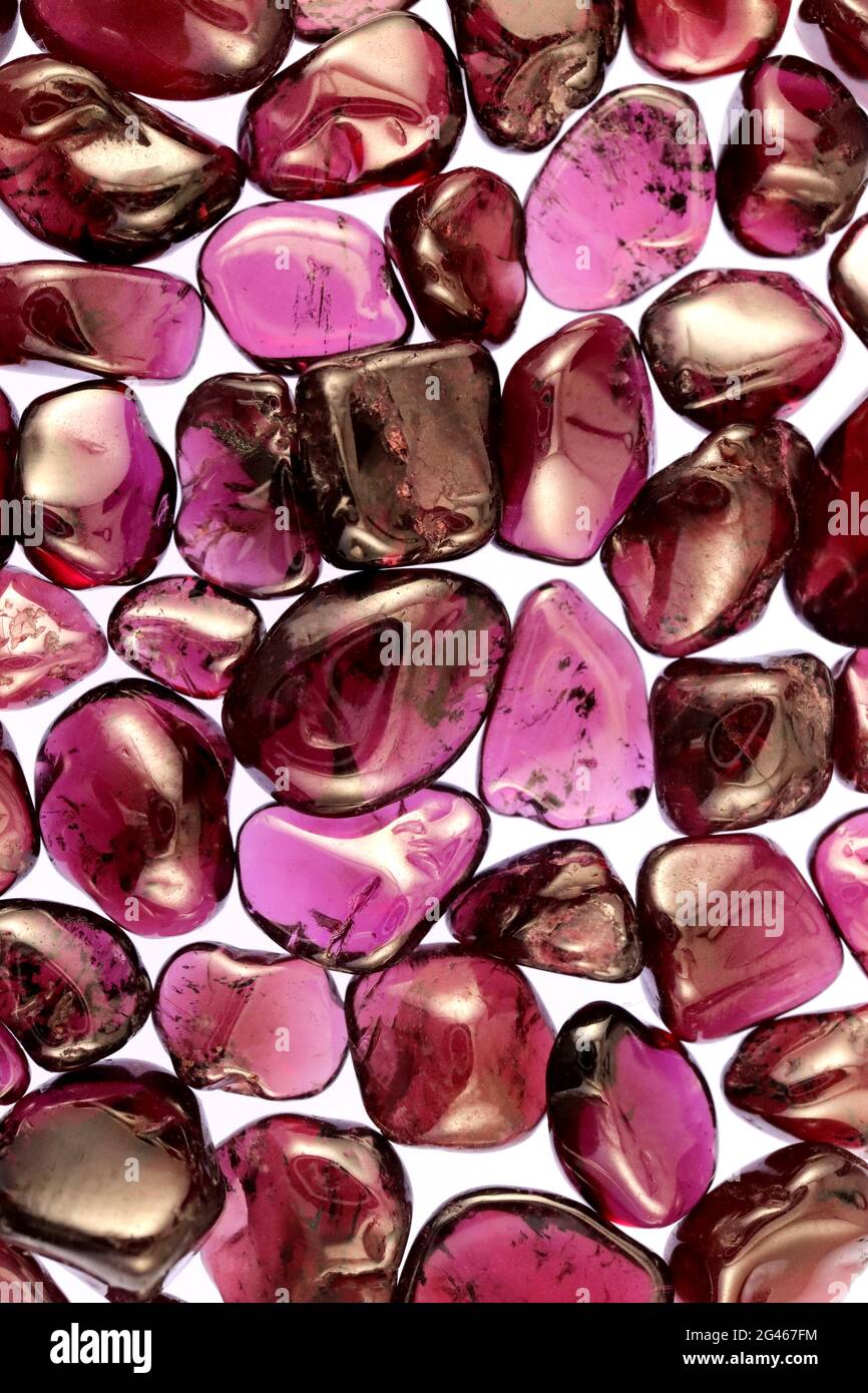 Garnet heap jewel stones texture on white light background Stock Photo ...
