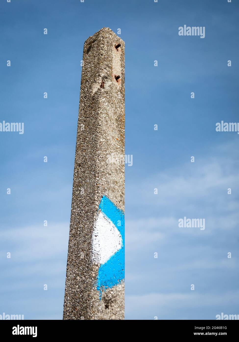 Post bollard of concrete with blue sky Stock Photo - Alamy