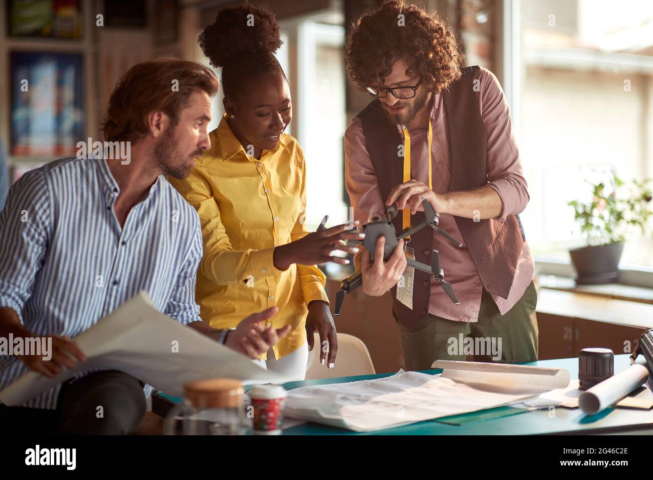 A group of young creative people in a working atmosphere in the office ...